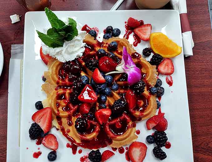 This Belgian waffle dressed for a berry-filled red carpet event. Even the mint leaf got an invitation to the party.