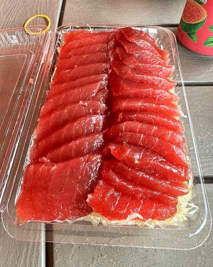 Tuna sashimi arranged with the precision of a jeweler displaying rubies. This is the kind of simplicity that makes chefs with tweezers weep with envy.