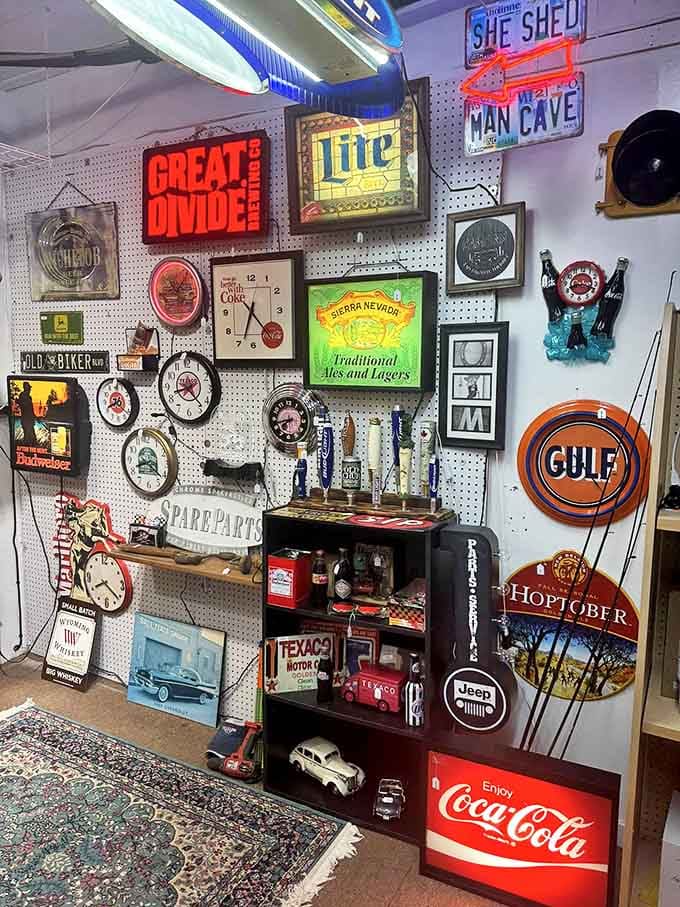 The "man cave" wall is where beer signs meet nostalgia, and every husband suddenly remembers they "need" a Gulf Oil sign.