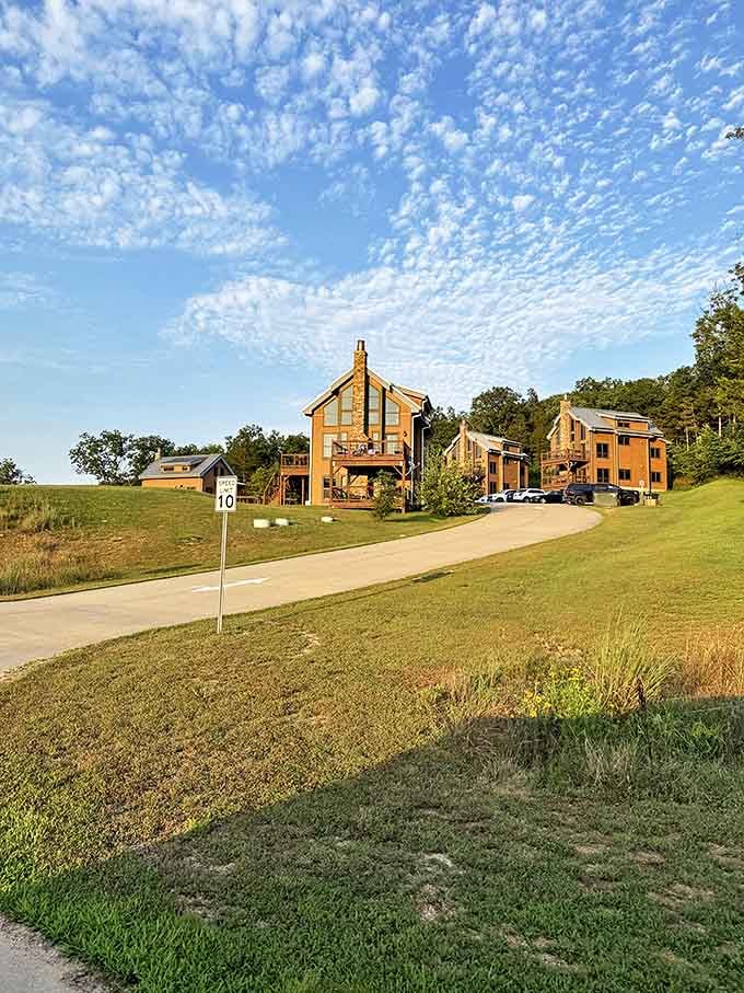 Clouds scatter across the sky like cotton candy pulled by invisible hands, framing the rustic amphitheater where nature provides the best backdrop.
