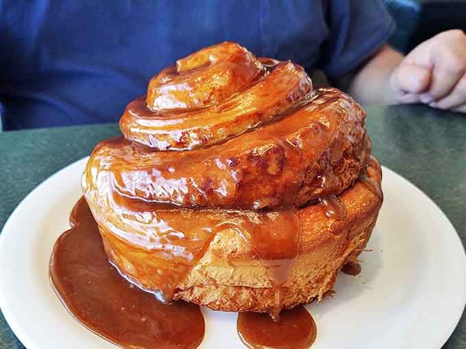 Behold the cinnamon roll that launched a thousand return visits. This spiral of buttery, cinnamon-laced glory could make a grown adult weep with joy.
