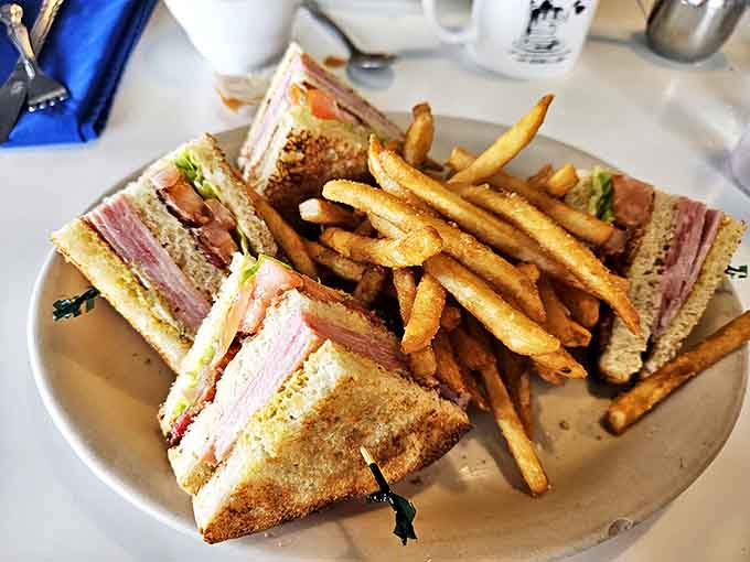 The club sandwich – architecture you can eat, with layers so perfect they'd make Frank Lloyd Wright weep with joy.