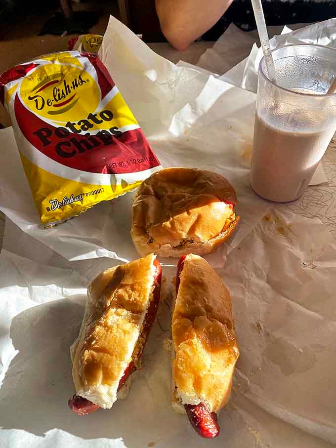 The holy trinity of roadside dining: a perfectly charred hot dog, crisp potato chips, and a creamy malt. Simplicity that somehow tastes better than complexity.
