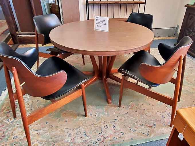 This Danish modern dining set isn't just furniture—it's a time machine to cocktail parties where guests discussed the moon landing over Old Fashioneds.