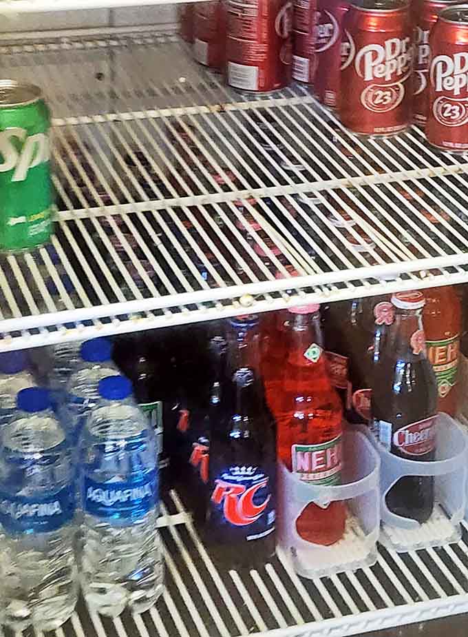 The drink cooler might be simple, but after that spicy mustard sauce, you'll appreciate these cold companions. RC Cola with barbecue? Pure Southern poetry.