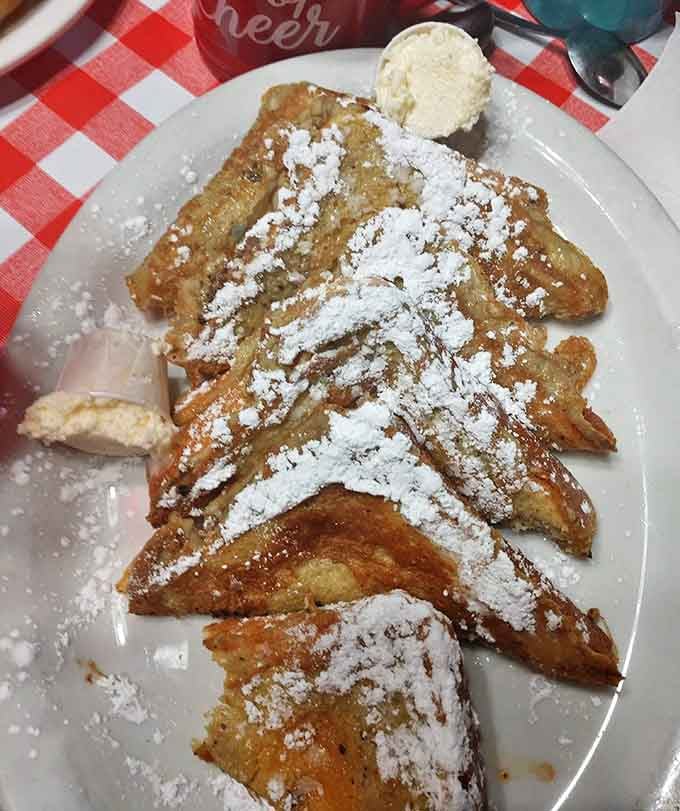 French toast that looks like it graduated from culinary school – perfectly golden, dusted with powdered sugar, and ready for its close-up.