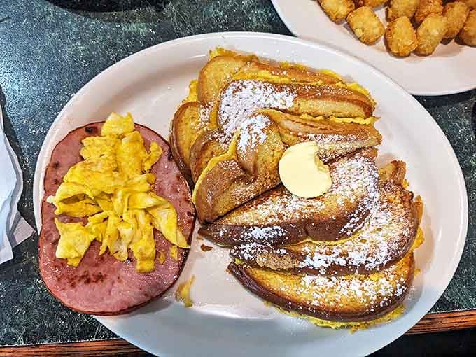 French toast dusted with powdered sugar alongside country ham—proof that breakfast can be both a hug and a handshake at the same time.