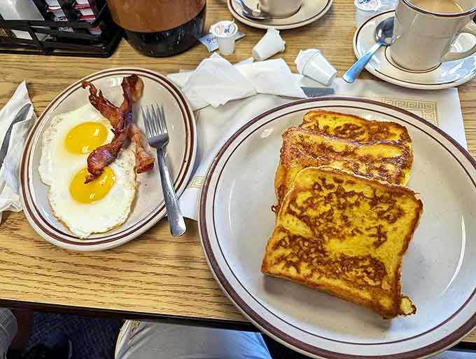 Breakfast perfection doesn't need to be complicated: golden-crisp French toast, eggs with sunset-yellow yolks, and bacon that's achieved the ideal crisp-to-chew ratio.