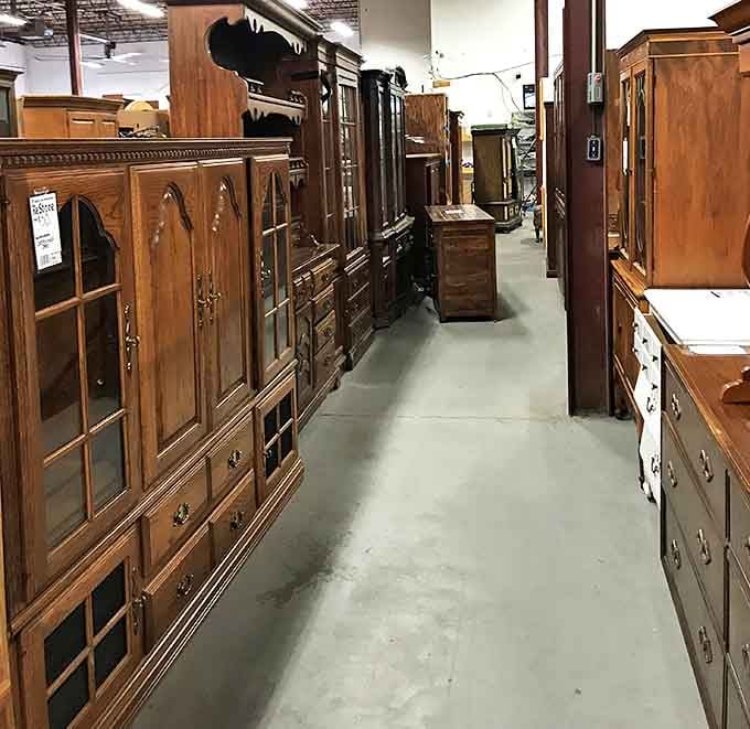 The cabinet corridor&mdash;where solid oak masterpieces stand at attention. These aren't just storage solutions; they're time machines with drawers.