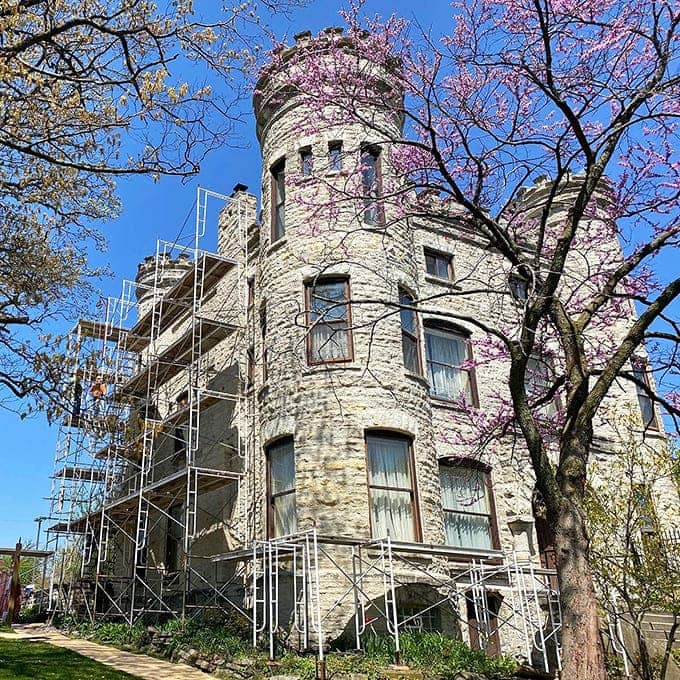 Scaffolding hugs the castle walls like an architectural embrace, evidence of the ongoing preservation efforts that keep this 19th-century fantasy standing proudly in Beverly.