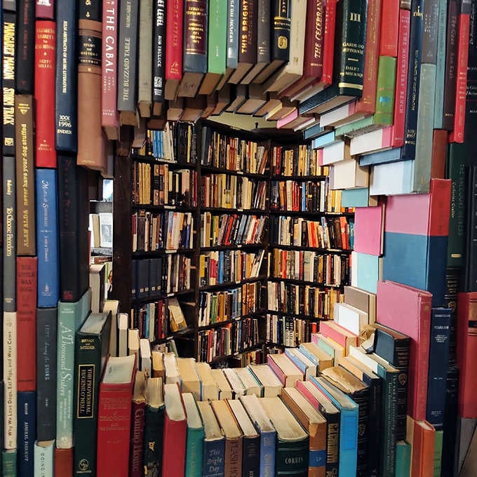 A bibliophile's infinity mirror where books create impossible geometry. Escher would approve of this literary optical illusion.