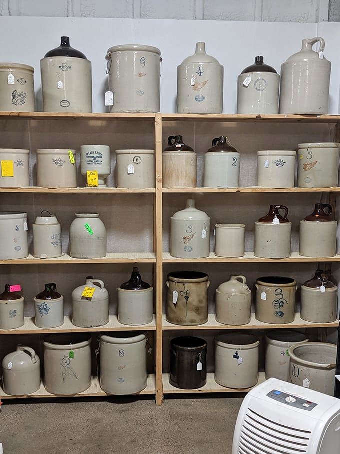 An army of stoneware crocks stands ready for duty, veterans of countless kitchens where pickles were fermented and beans were stored before refrigeration ruled.