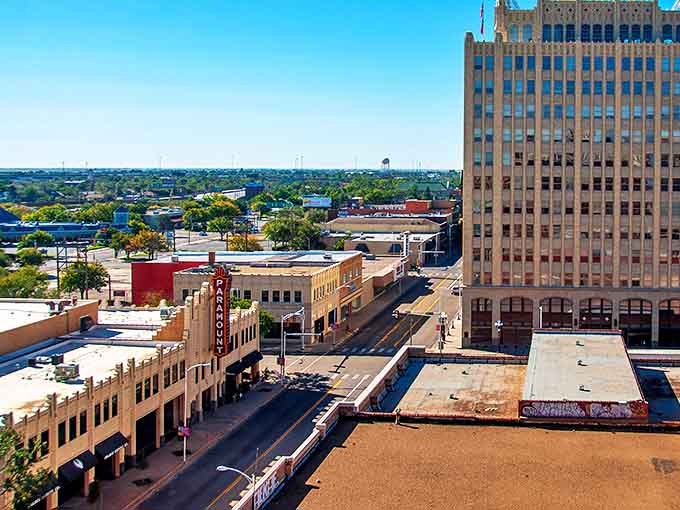 Historic buildings line Amarillo's main drag, where the Paramount's neon glow has guided visitors through the Panhandle night for decades.