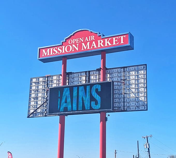 The classic red and blue Mission Open Air Market sign promises adventures in treasure hunting below.