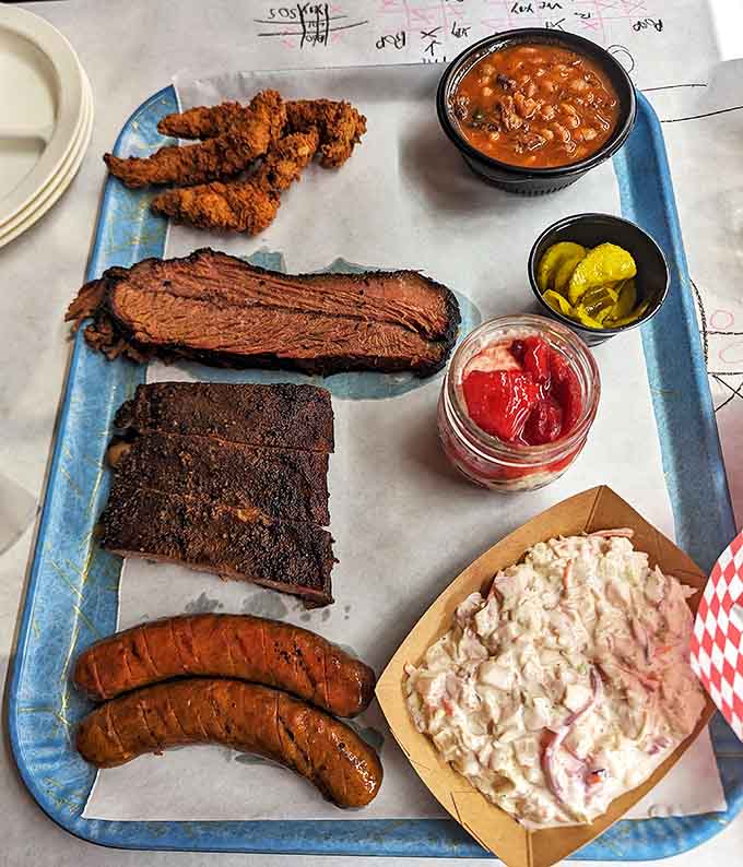 A barbecue sampler that hits all the right notes—brisket, sausage, chicken, and sides that know their supporting role perfectly.