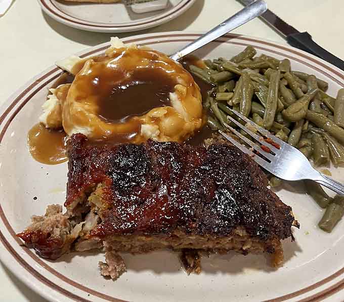Meatloaf, mashed potatoes, and green beans &ndash; the holy trinity of heartland dining that reminds you why classics became classics in the first place.
