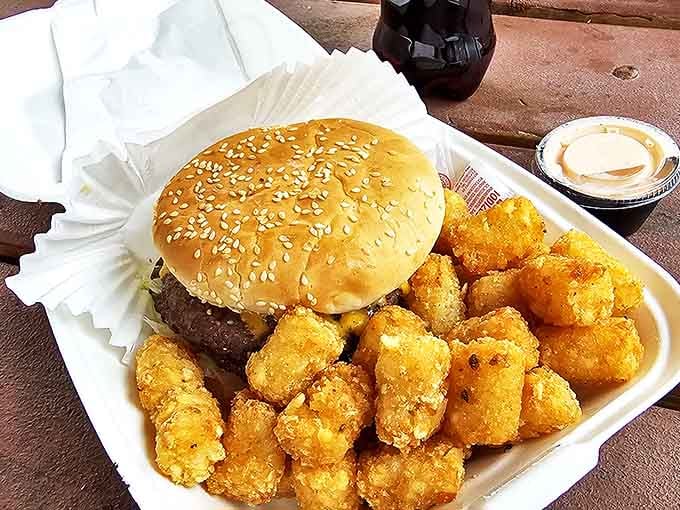 Behold the one-pound cheeseburger in all its sliced glory&mdash;a wheel of excess that makes portion control seem like a concept from another dimension.