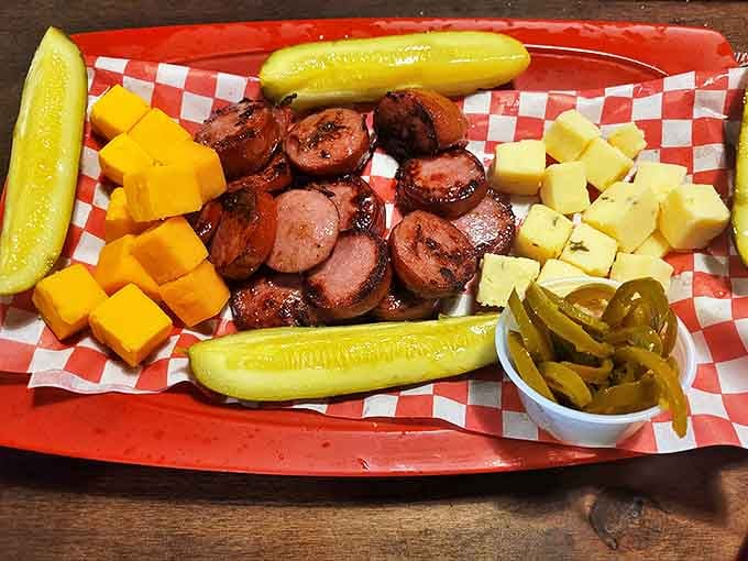 Meat and cheese, the universal language of hospitality. This sausage and cheese platter with pickles is Arkansas's version of a charcuterie board.