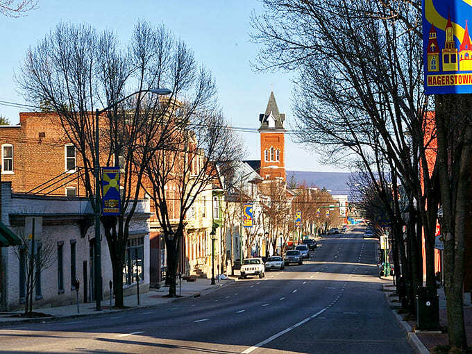 Winter sunlight bathes downtown streets in golden hour glow, highlighting church spires and historic facades that have witnessed centuries of American history.