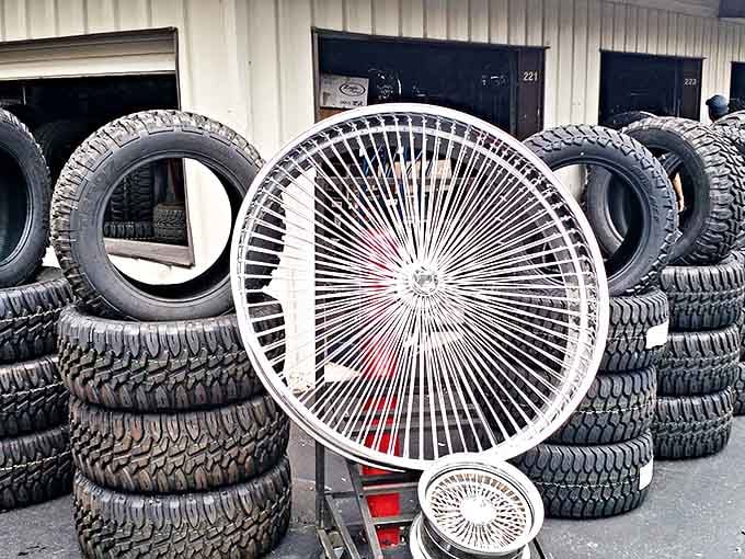 Tire kingdom! Where rubber meets the road&mdash;and your wallet. That chrome wire wheel looks like it belongs on a 1970s Cadillac's greatest hits album.