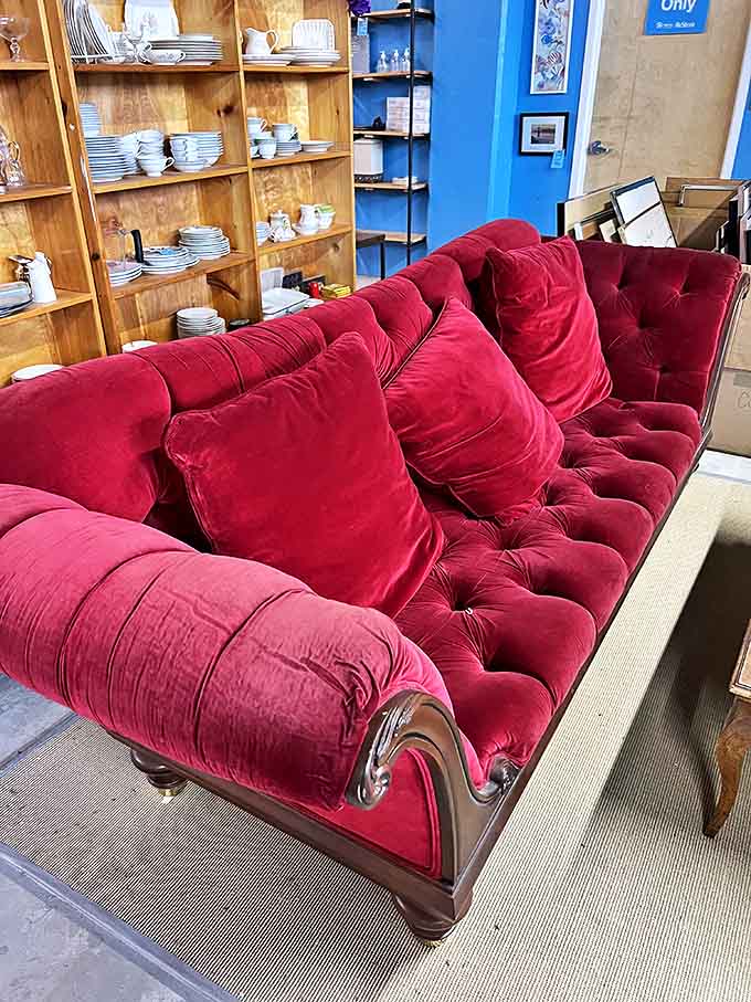 This crimson velvet sofa isn't just furniture &ndash; it's a statement piece that demands to be the center of attention in any room.