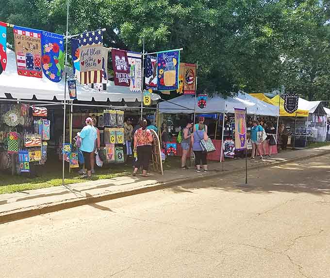 Canton Flea Market's white tents create a festival atmosphere where handcrafted treasures await the early birds with flashlights.