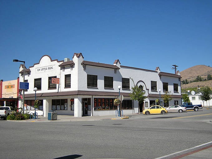 The historic Elk's Little Bear building stands proudly in downtown Chelan, its distinctive white facade gleaming against blue skies.