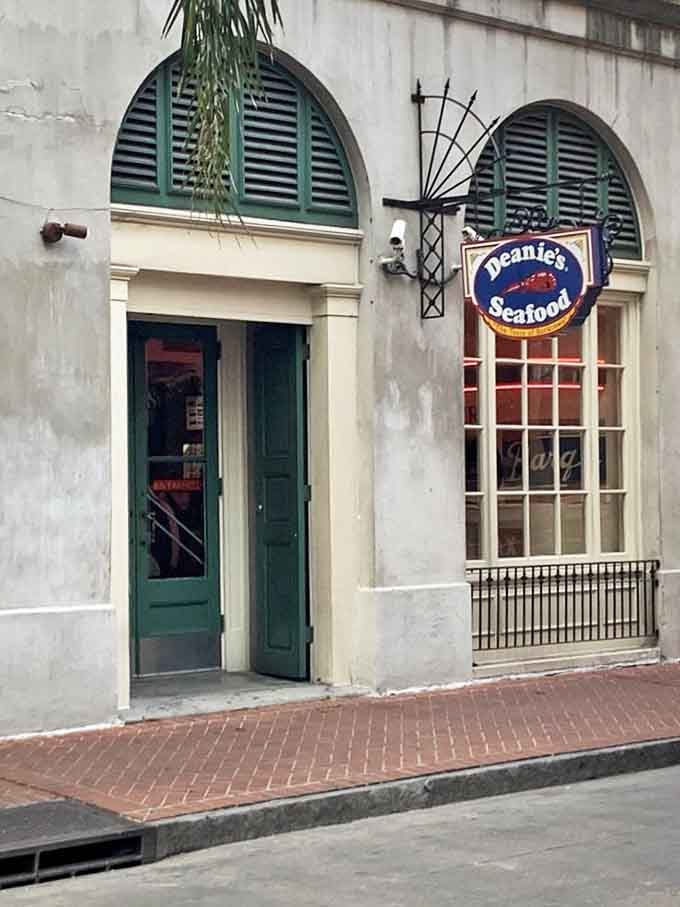 Historic charm meets seafood abundance at Deanie's. Those French Quarter arches frame a Louisiana institution!