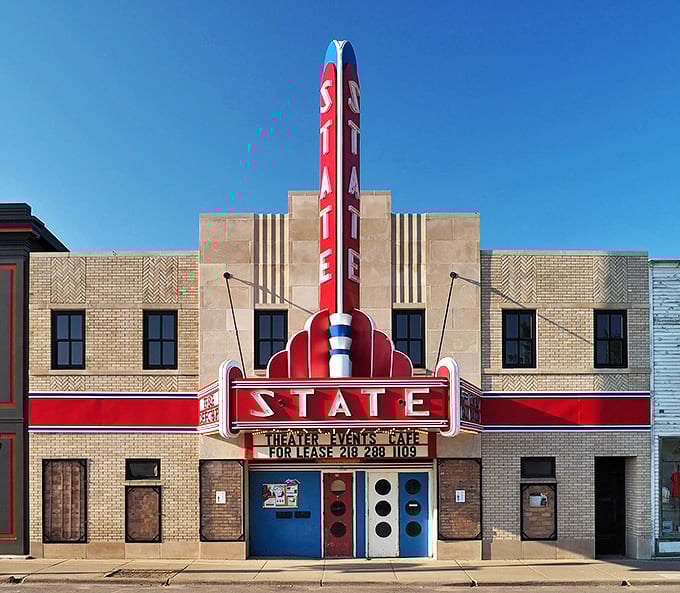 Ely's historic State Theater stands as a vibrant red beacon of small-town charm, where movie magic meets Minnesota nostalgia.