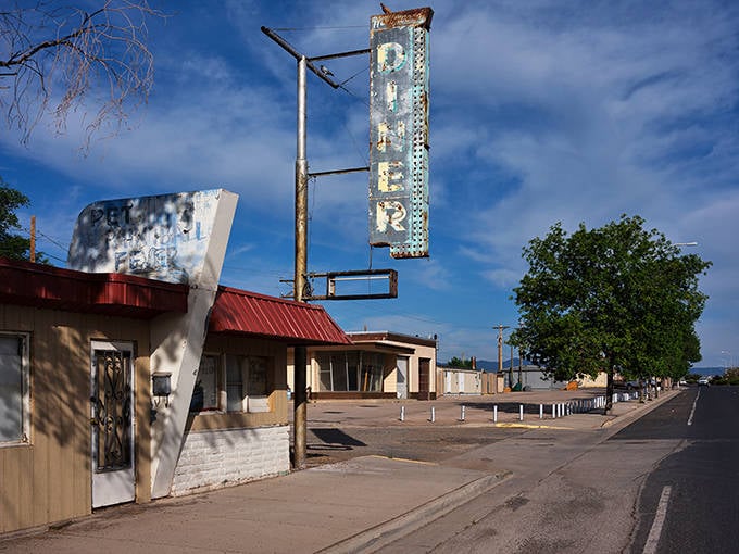 Vintage neon signs in Grants stand as colorful beacons of Route 66's golden age, inviting travelers to stop and explore.