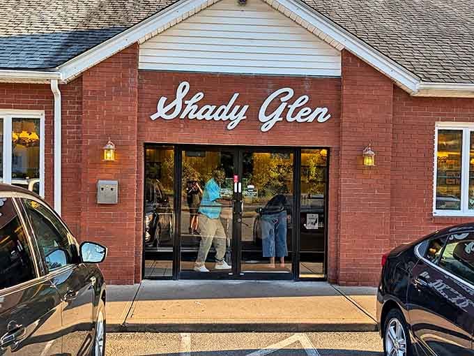 Shady Glen's unassuming brick exterior hides legendary burgers within. This Manchester institution proves you can't judge a diner by its facade.