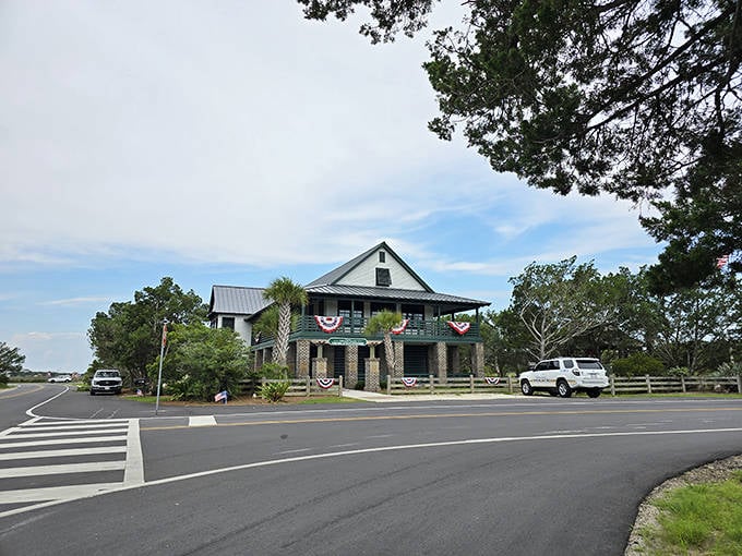 This historic Lowcountry building on Pawleys Island, adorned with patriotic bunting, embodies the timeless charm that makes these South Carolina towns so special.