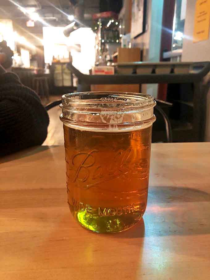 A golden craft beer in a mason jar&mdash;because what pairs better with artisanal sandwiches than locally brewed liquid sunshine?