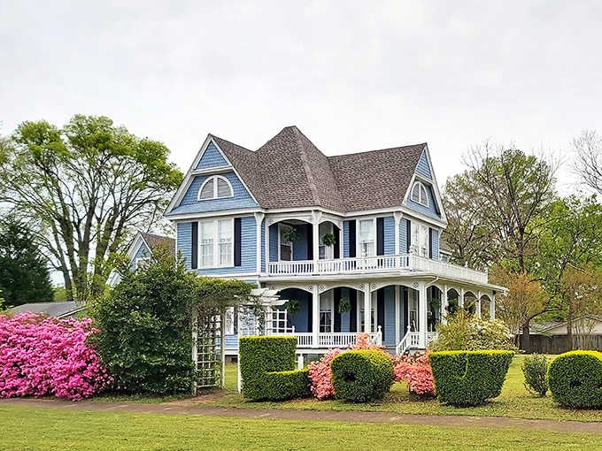 This blue Victorian beauty with its wraparound porches practically begs you to sit a spell with sweet tea and gossip about the neighbors.