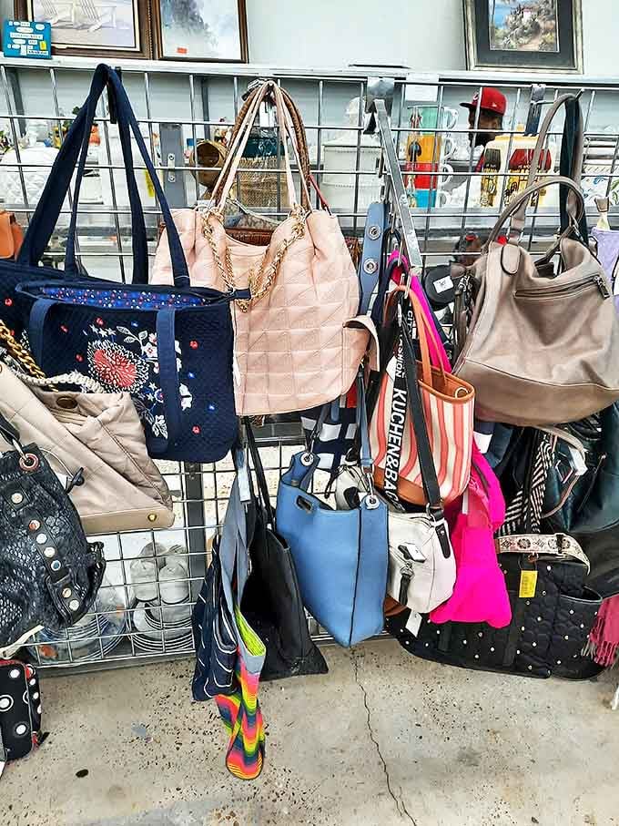 Handbag heaven! Designer purses and everyday totes hang in suspended animation, waiting for their second chance to carry someone's essentials in style.