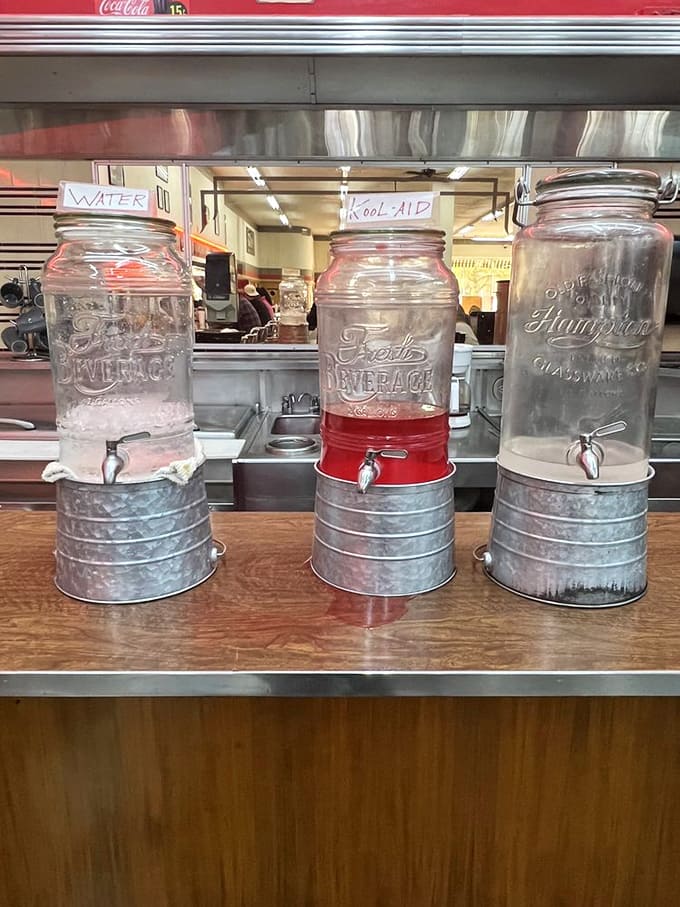 Vintage beverage dispensers that make water and Kool-Aid feel like special occasion drinks—Mason jars elevated to five-star service with those charming little spigots.