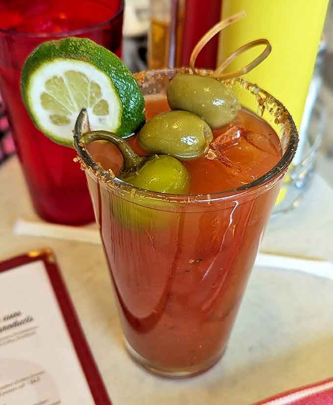 A Bloody Mary that doubles as both beverage and appetizer. Those olives aren't garnish—they're a bonus round!