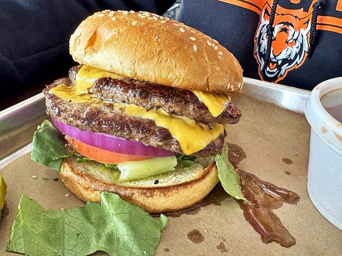 Not just another burger&mdash;this towering creation demands a strategy, a napkin arsenal, and possibly a post-meal nap. Worth every bite.