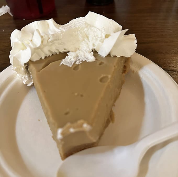 Butterscotch pie topped with a cloud of whipped cream—proof that angels are real and they moonlight as pastry chefs in Tennessee.