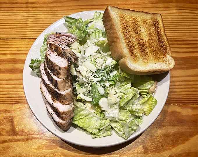 When you need something green to balance the meat sweats. The charred chicken adds smoky punctuation to a crisp Caesar.