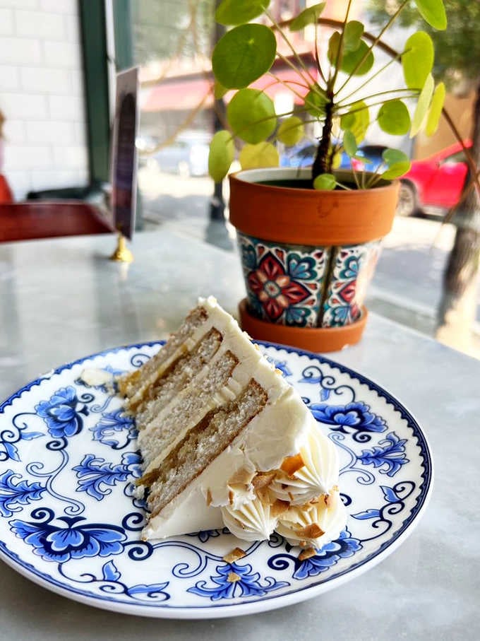 Layer cake perfection on blue and white china&mdash;the kind of dessert that makes you consider cake as a legitimate breakfast option.