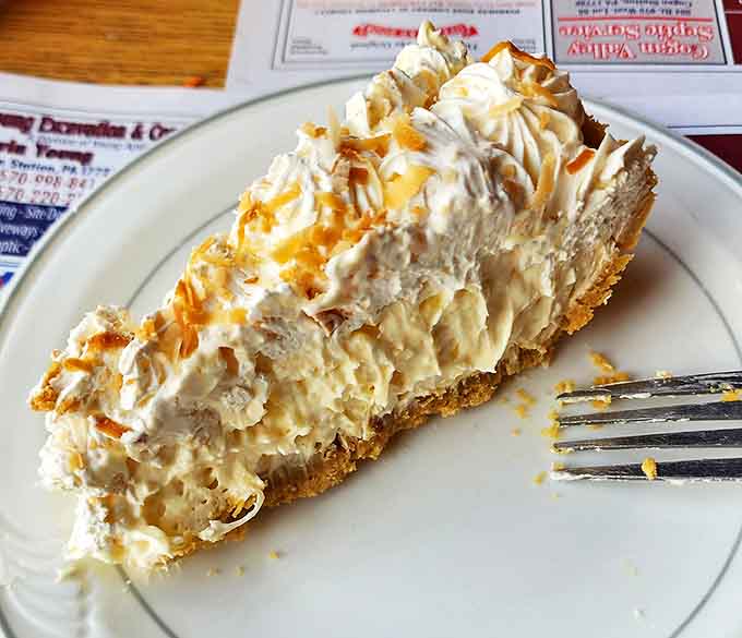 Coconut cream pie that would make your grandmother both jealous and proud. Cloud-like filling on a perfect crust &ndash; dessert nirvana.