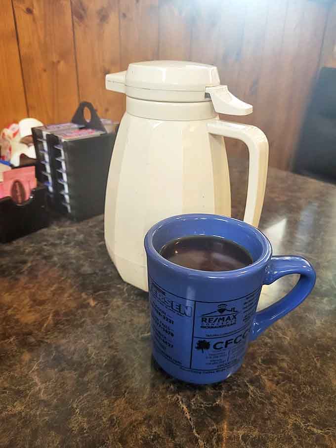 The blue mug says it all—this isn't fancy coffee, it's necessary coffee. The kind that fuels farmers, professors, and everyone in between.
