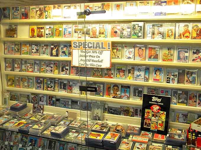 Baseball cards displayed like the Smithsonian treasures they are. Each one a tiny time machine to when heroes wore cleats instead of capes.