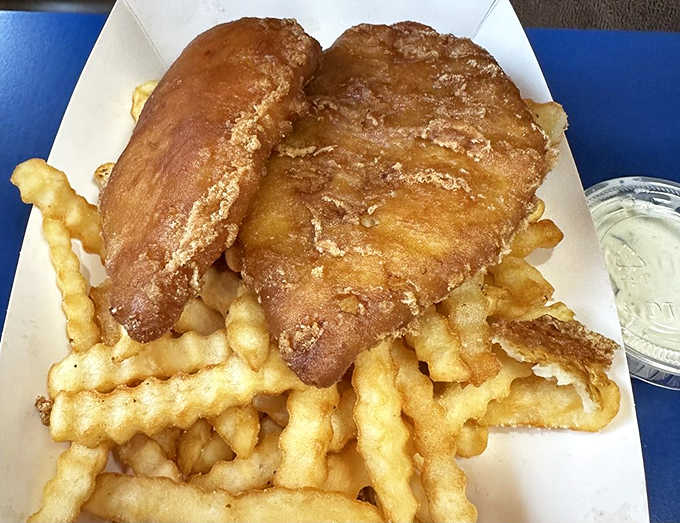 Golden-battered fish rests atop a bed of crispy fries&mdash;the kind of simple pleasure that makes you wonder why anyone bothered inventing molecular gastronomy.