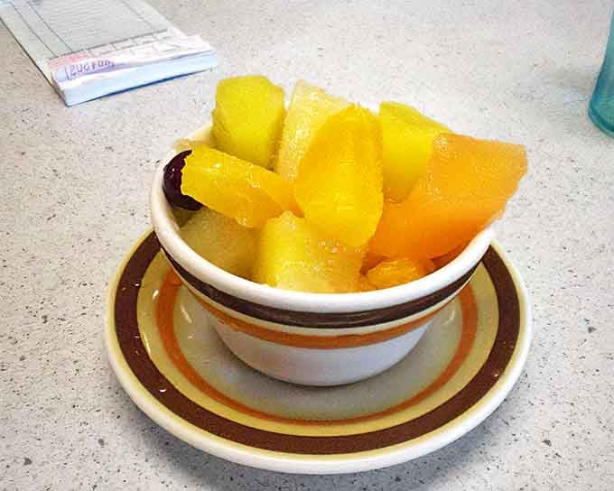 Fruit cup: nature's way of saying "I approve of that stack of pancakes you just demolished." Vitamin C never looked so appealing.