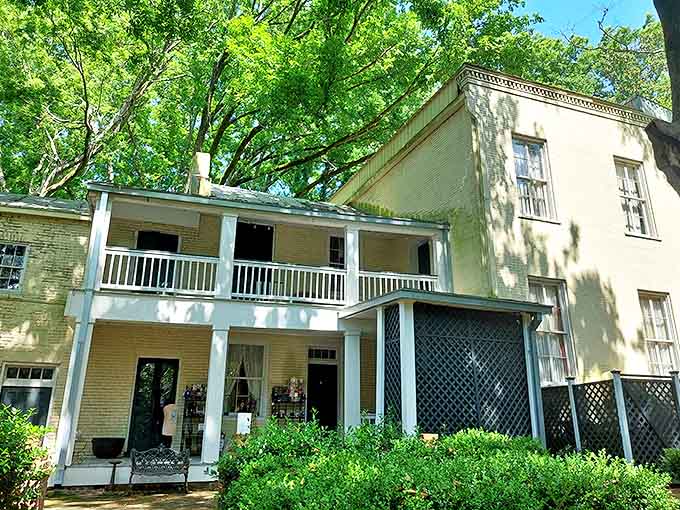 McRaven Tour Home's graceful porch invites visitors to sit a spell, proving Southern hospitality doesn't require a premium membership.
