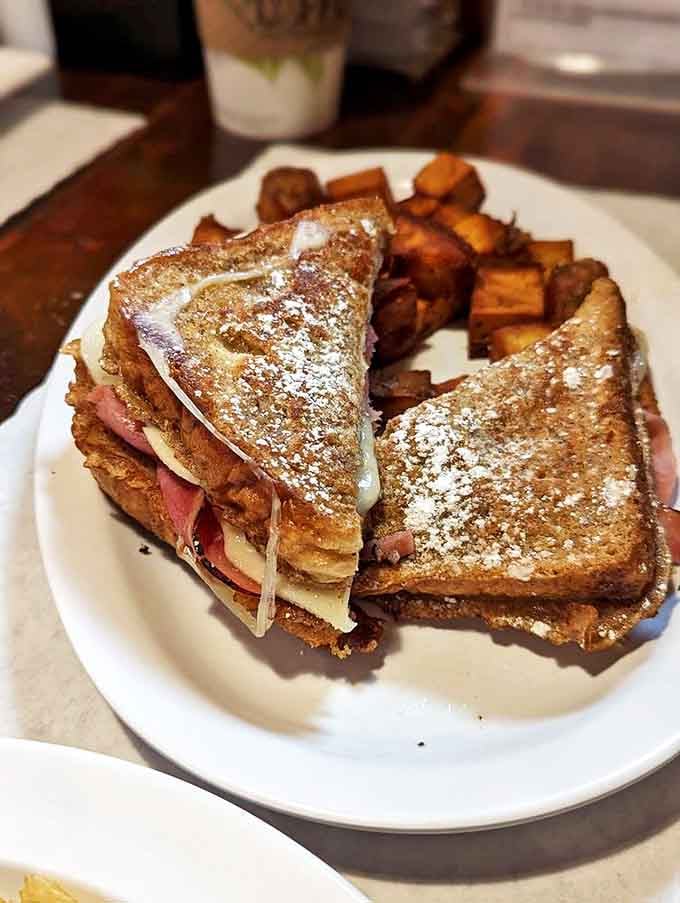 The Monte Cristo: where breakfast and lunch slow dance on your plate, with powdered sugar playing matchmaker to the sweet and savory romance.