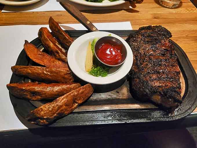 A New York strip with the perfect char, paired with steak fries that somehow manage to be both crispy and fluffy.