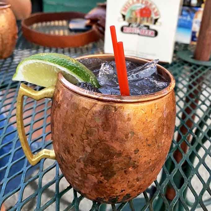 This Moscow Mule, served in a proper copper mug with a lime wedge, isn't just a drink&mdash;it's a refreshing escape that makes Iowa summer heat waves retreat in defeat.